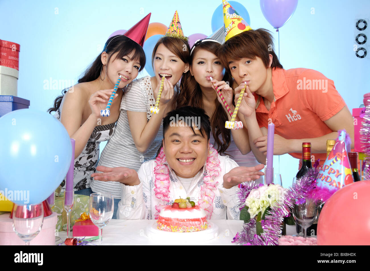 Friends celebrating a birthday party Stock Photo - Alamy