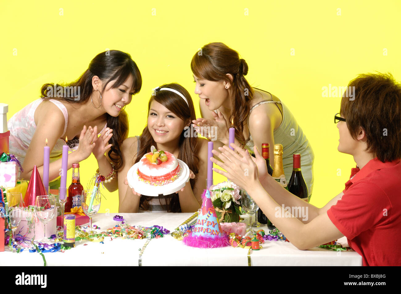 Friends celebrating a birthday party Stock Photo - Alamy