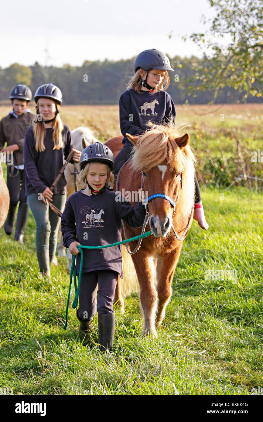 children riding ponies Stock Photo - Alamy