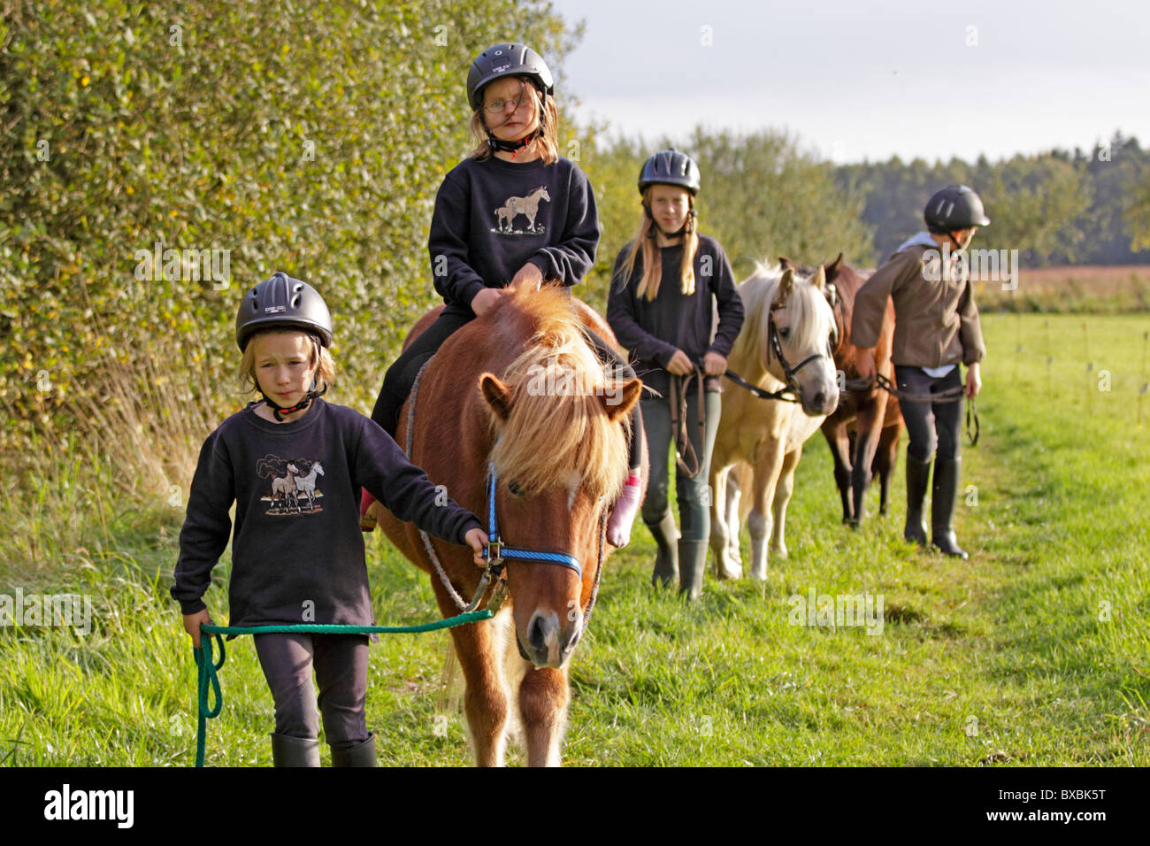 children riding ponies Stock Photo - Alamy