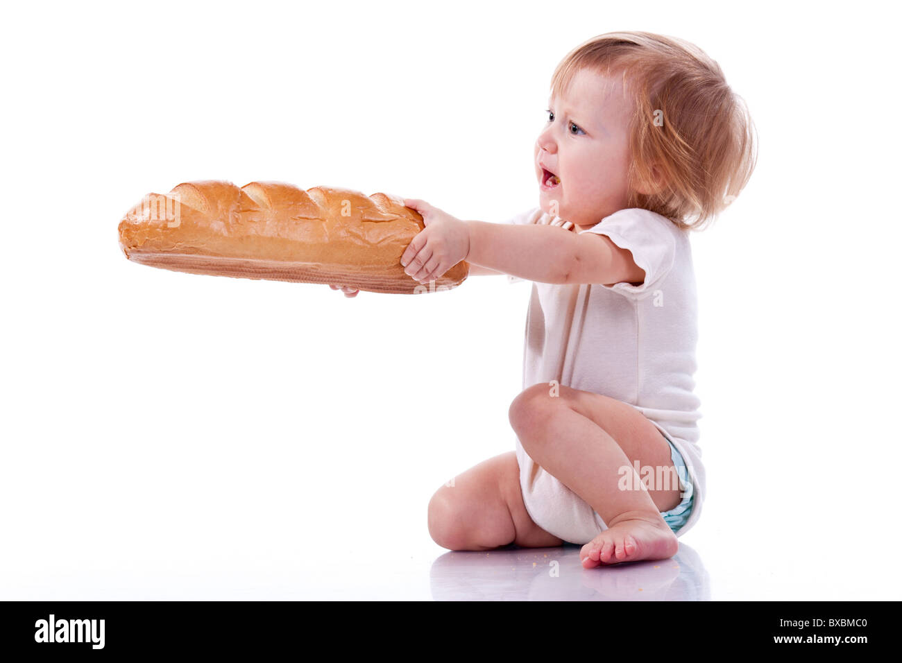Baby giving out a loaf of bread isolated on white Stock Photo - Alamy