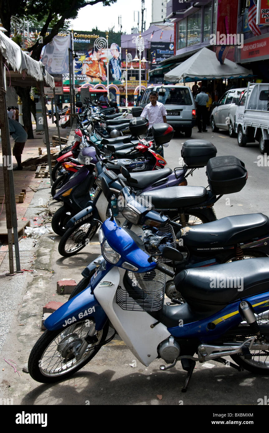 Mopeds parked at the side of the road in Kuala Lumpur in . Photo by ...