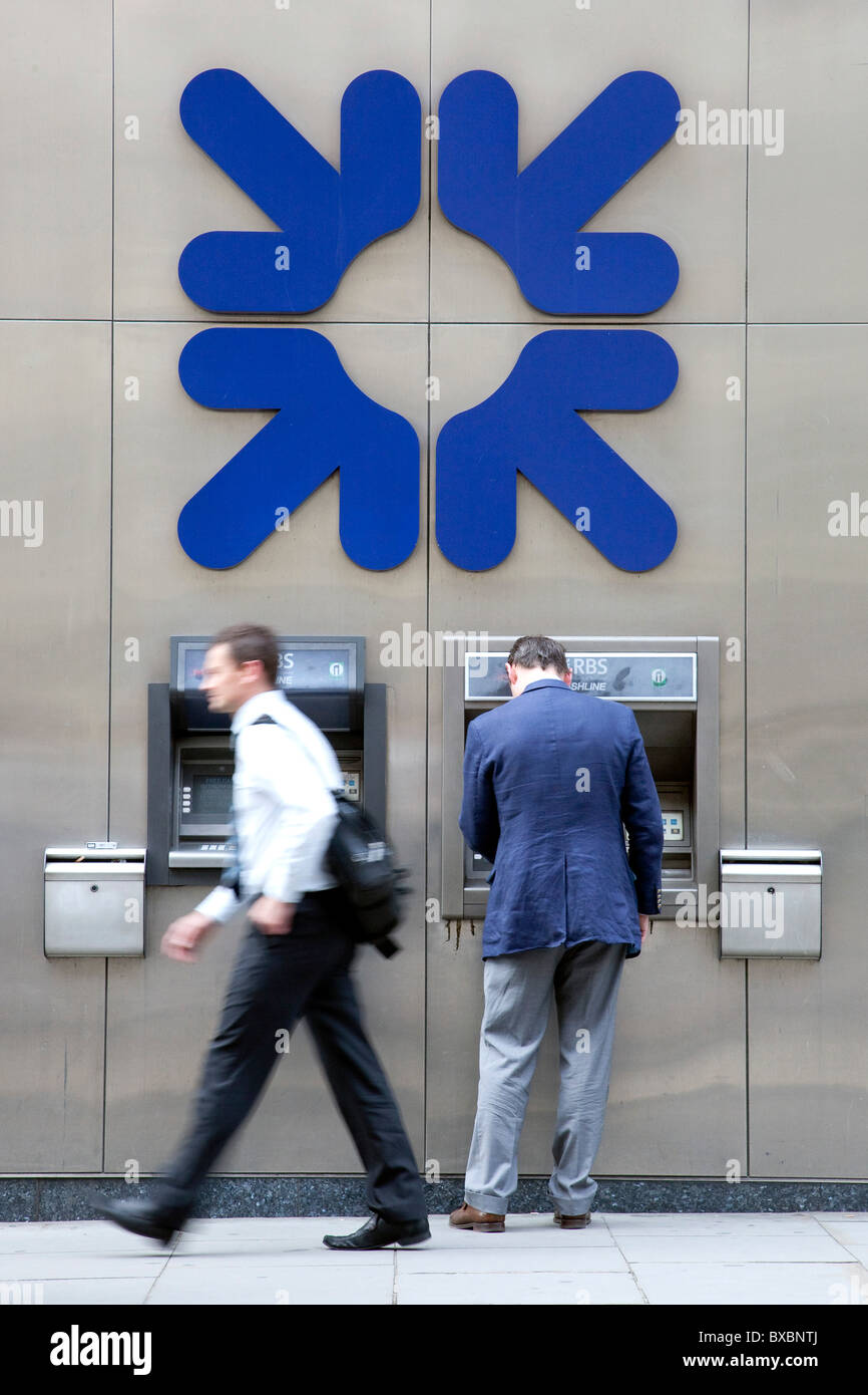 Man at the cash machine of the Royal Bank of Scotland, RBS, in London ...