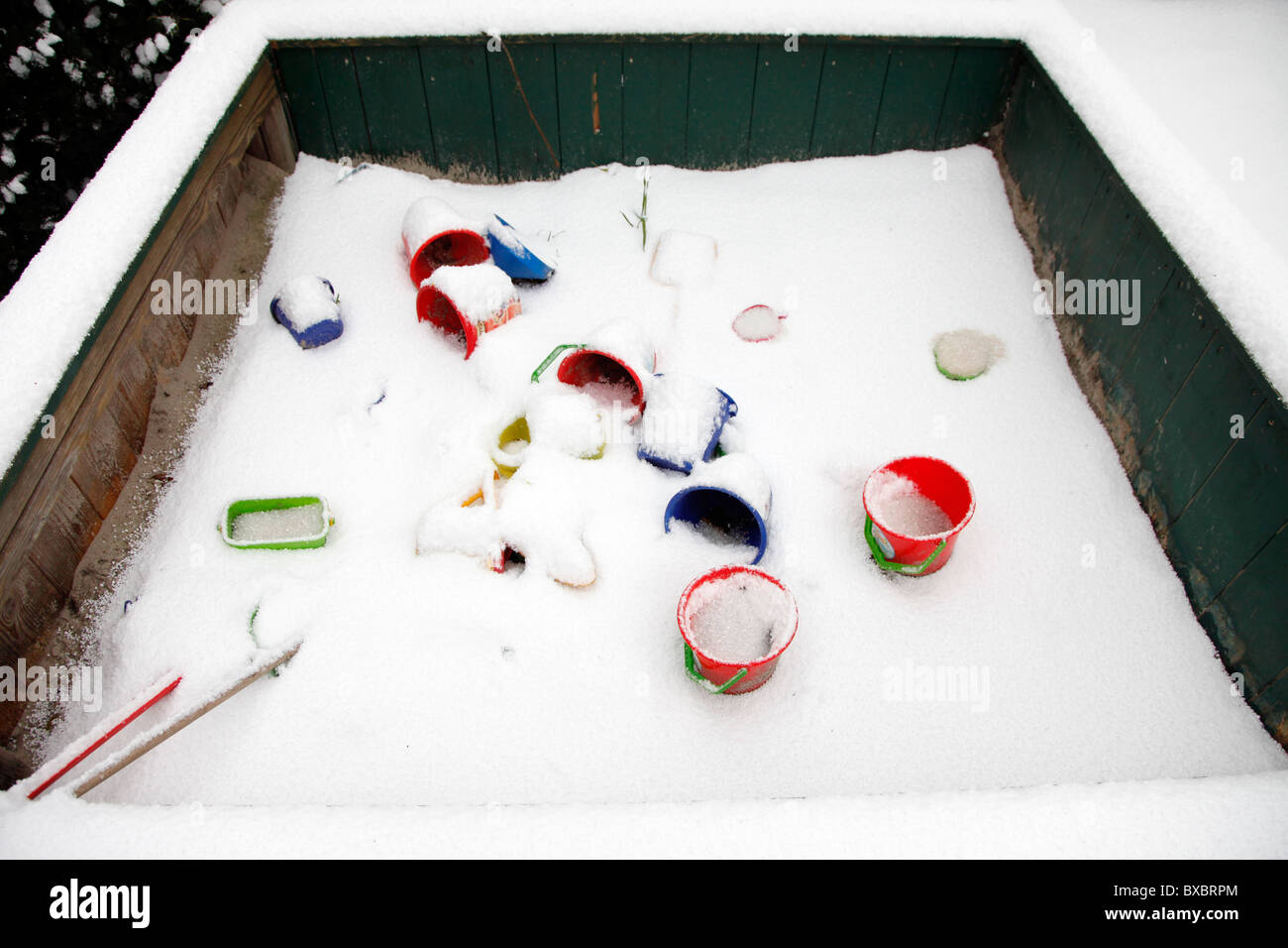 Children's sandbox, toys, covered with snow Stock Photo - Alamy