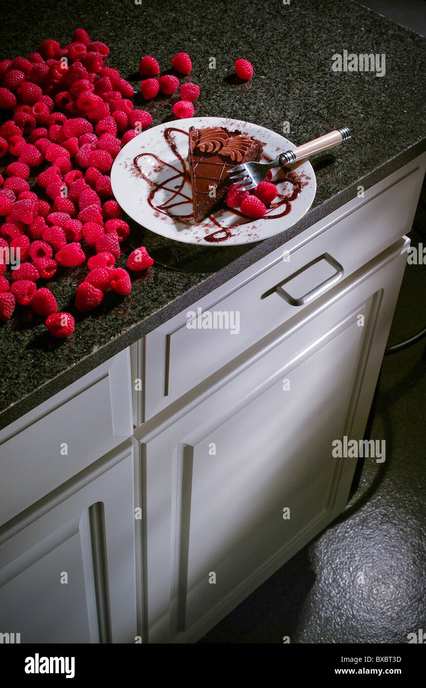 Kitchen counter top with dessert plate chocolate raspberry cake Stock ...