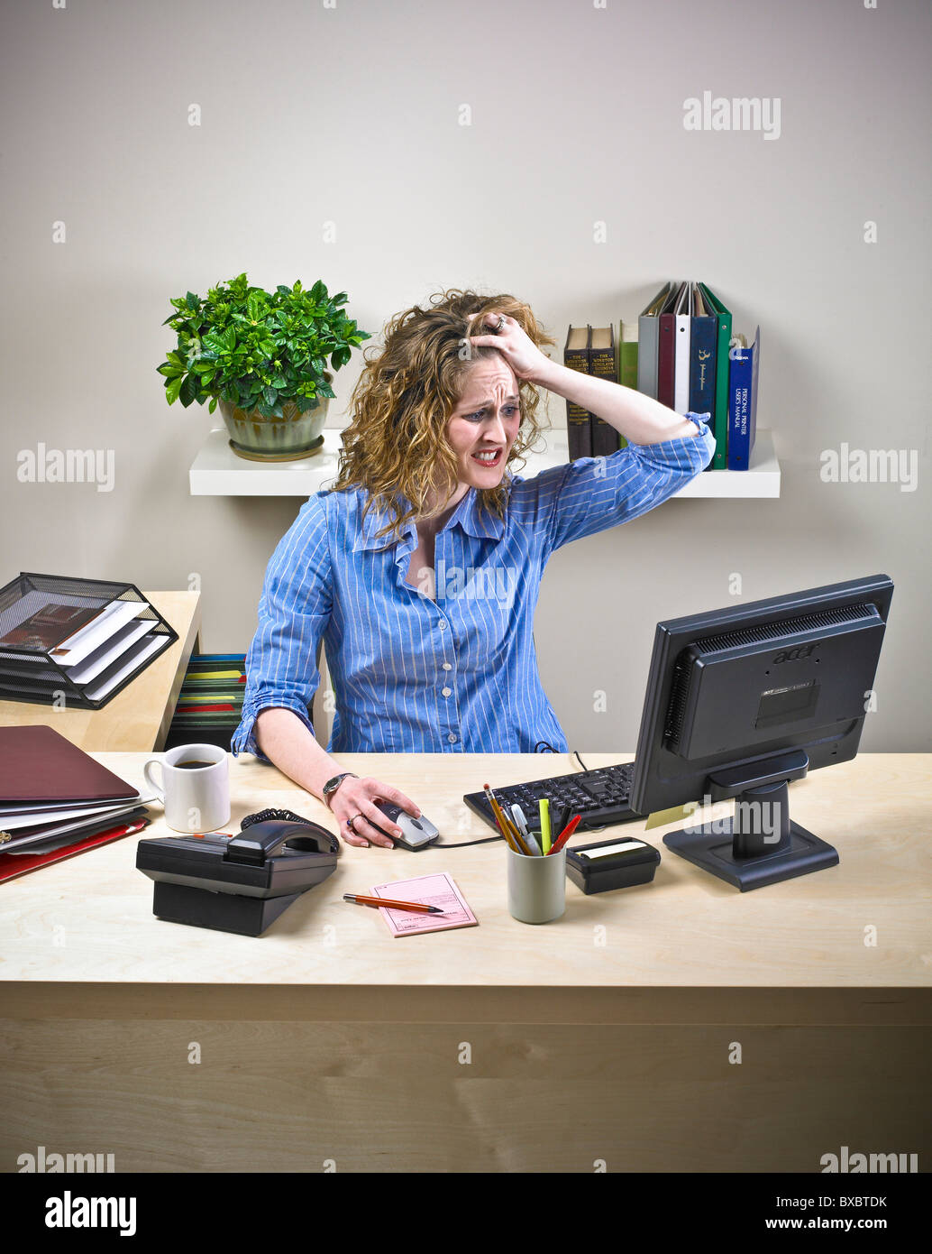 Female secretary, executive, office worker at computer desk. stressful ...