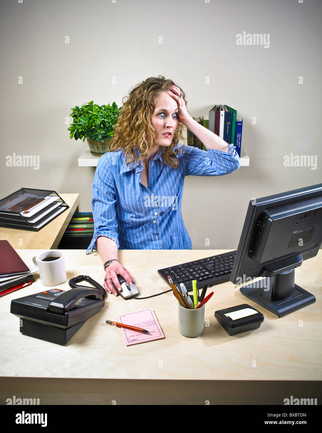 Female secretary, executive, office worker at computer desk. stressful ...