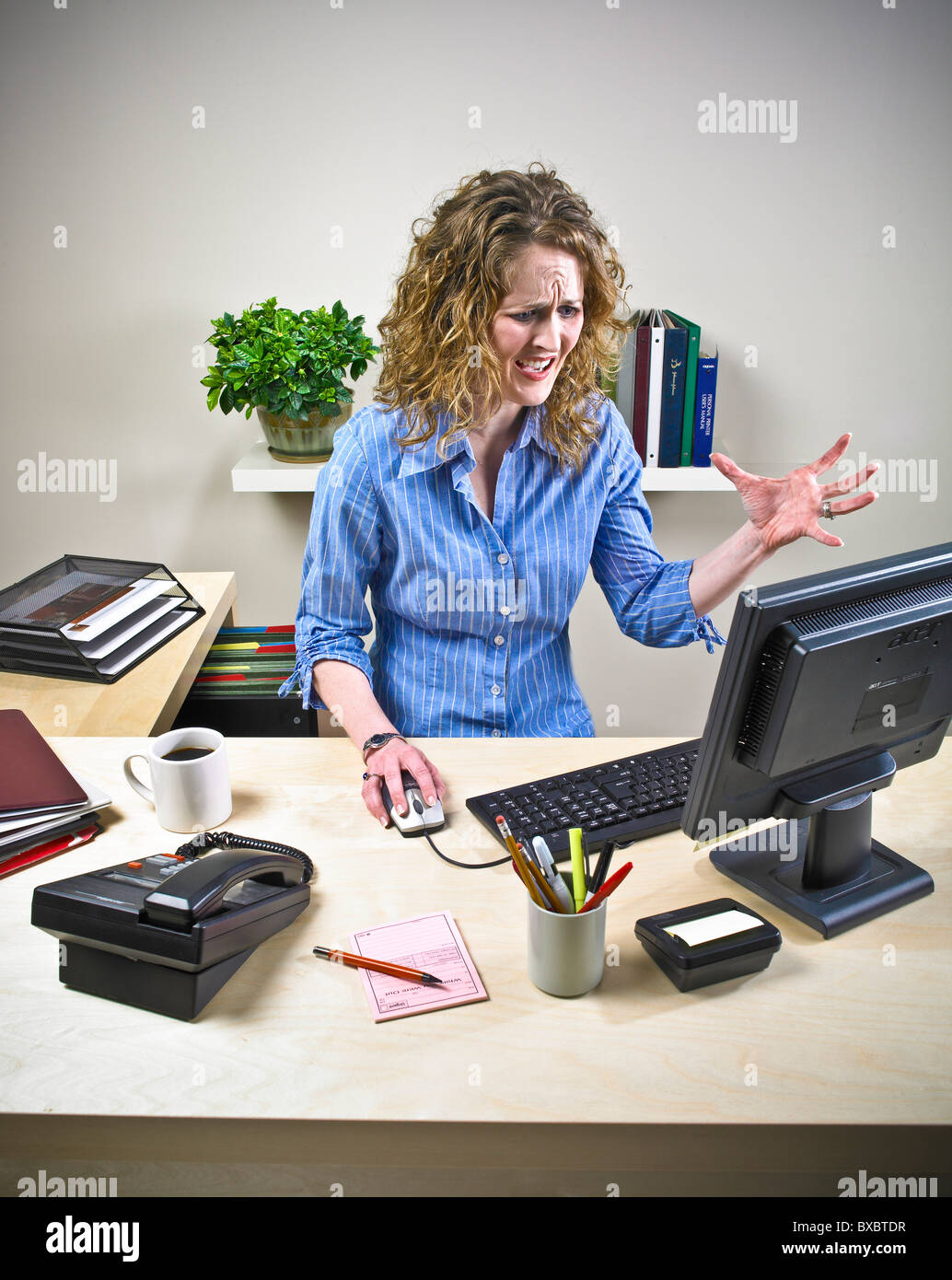 Female secretary, executive, office worker at computer desk. stressful ...