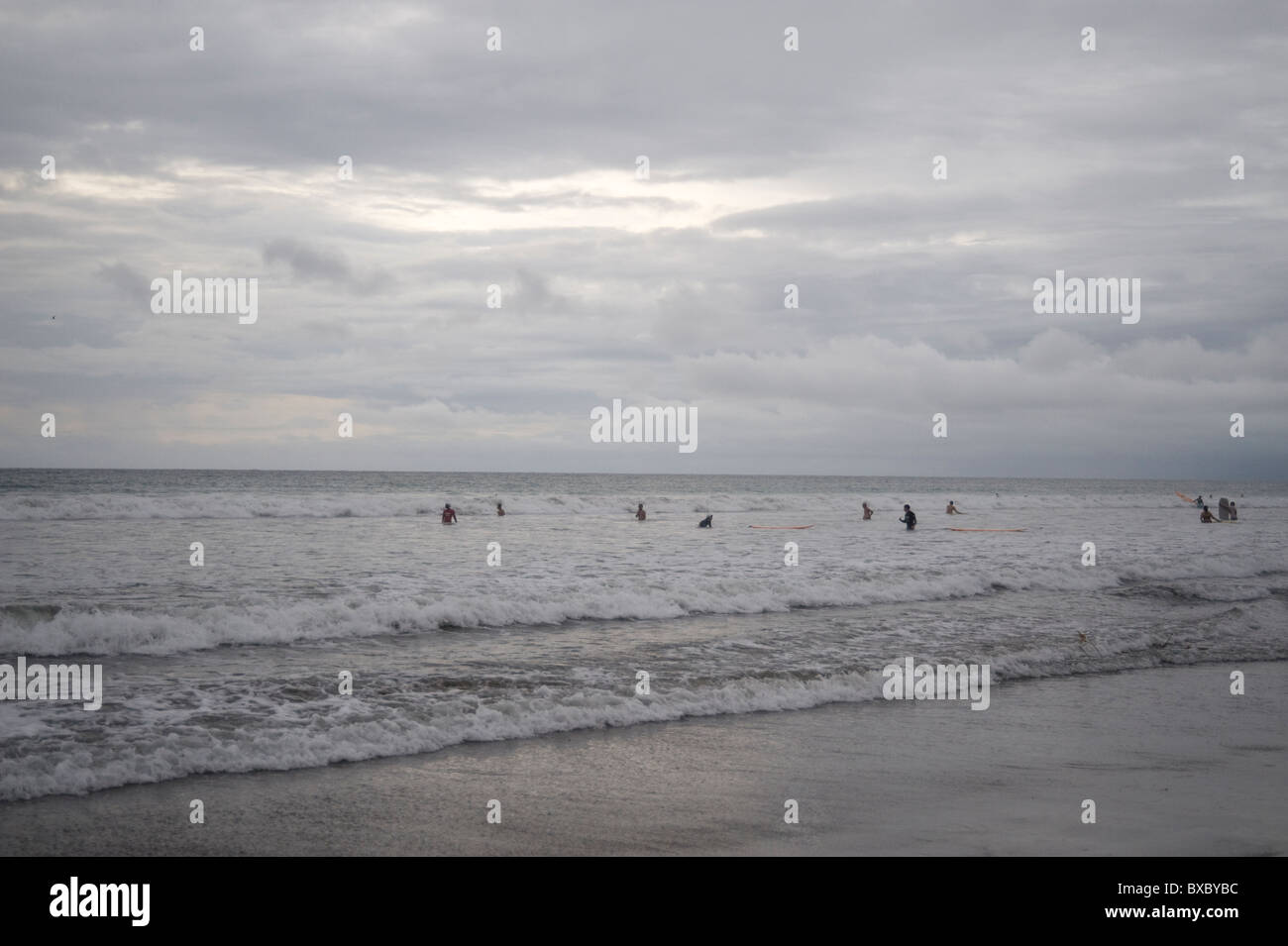 People swimming by the shoreline in Bali Stock Photo - Alamy