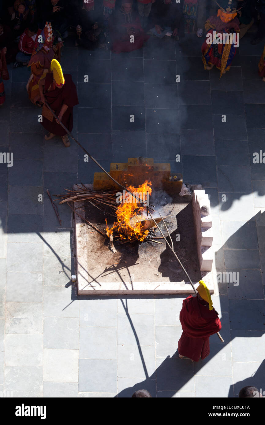 Buddhist monks burning a symbolic picture of the devil during the ...