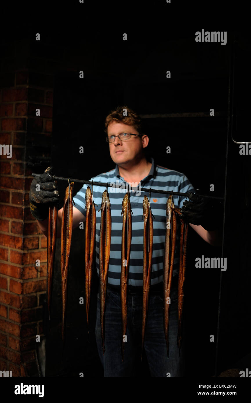 Jesse Pattison at Bowdens Farm Smokery, with smoked eel Stock Photo - Alamy