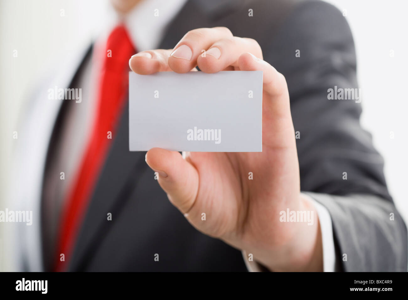 A businessman is showing his calling card Stock Photo - Alamy