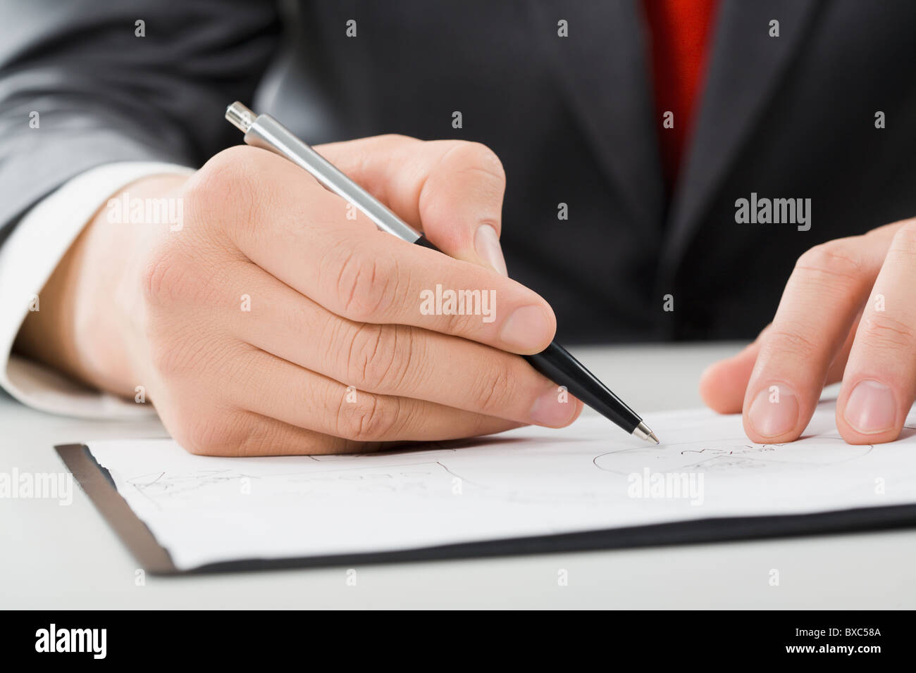 Close up of business hand writing a new plan of work Stock Photo - Alamy