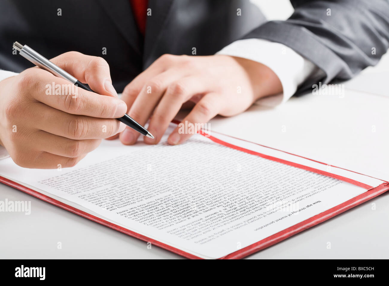 Creative image: male hands, pen and document Stock Photo - Alamy