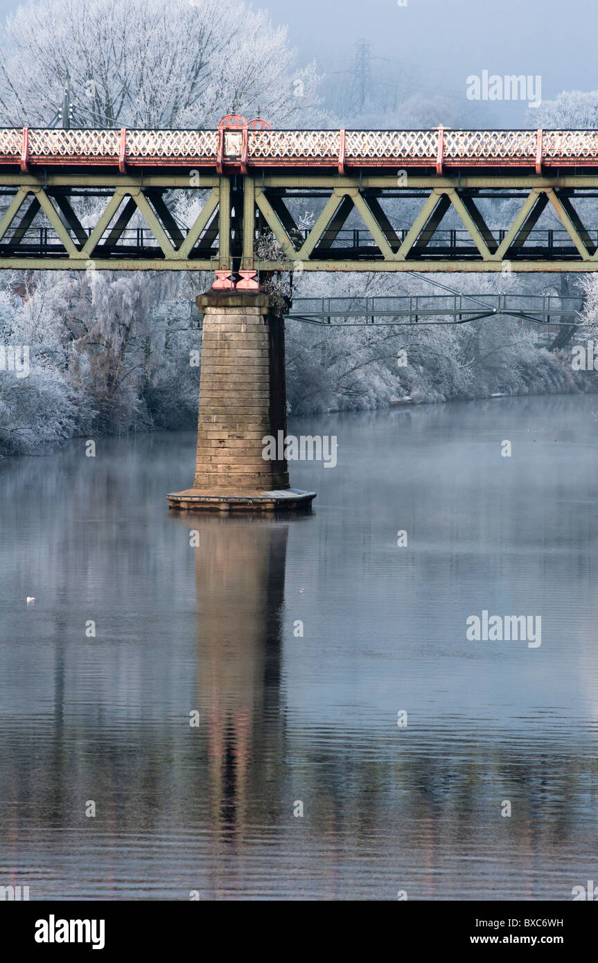 Railway bridge with frost covered trees, over the river Severn in ...