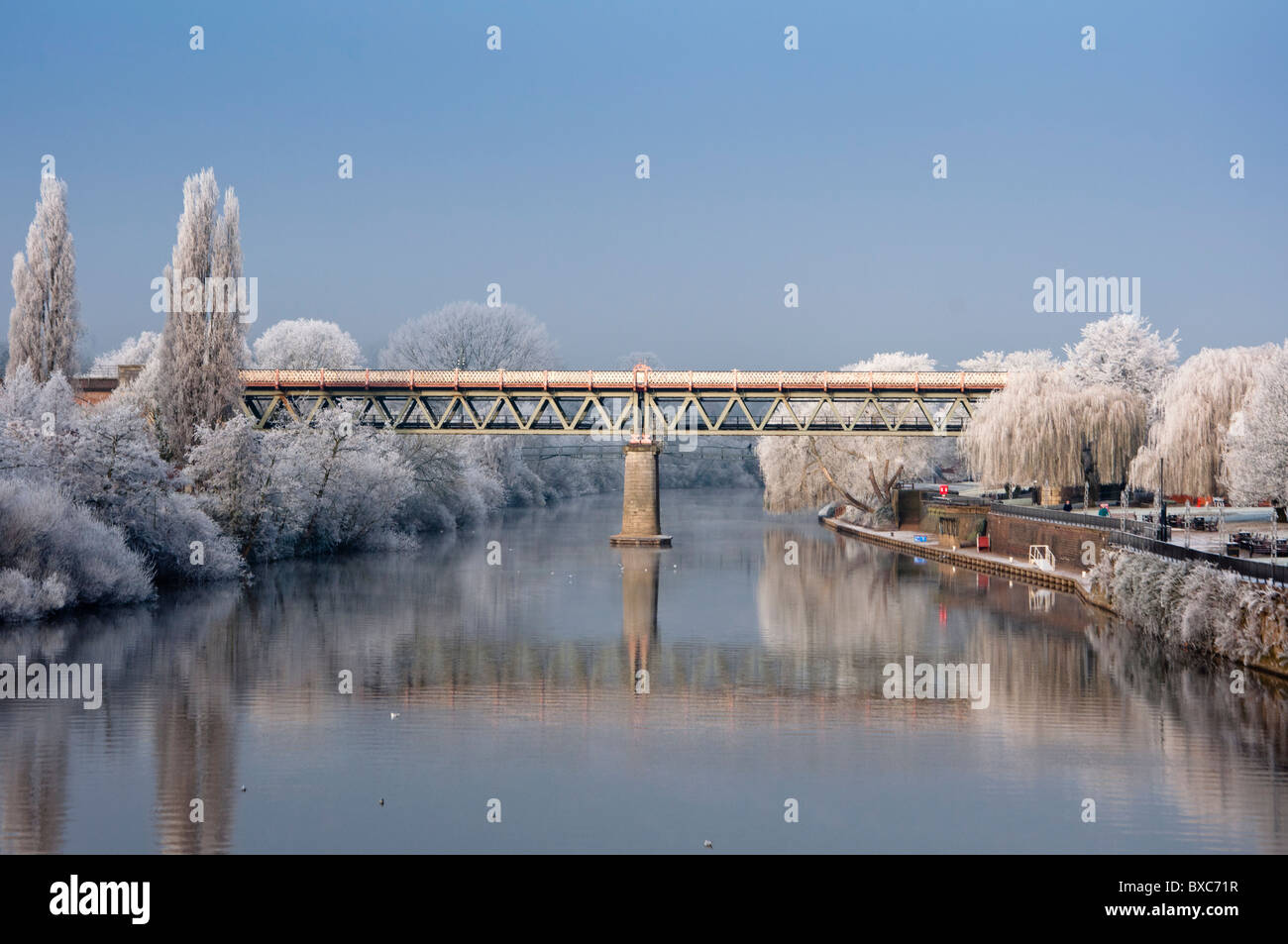Railway bridge with frost covered trees, over the river Severn in ...