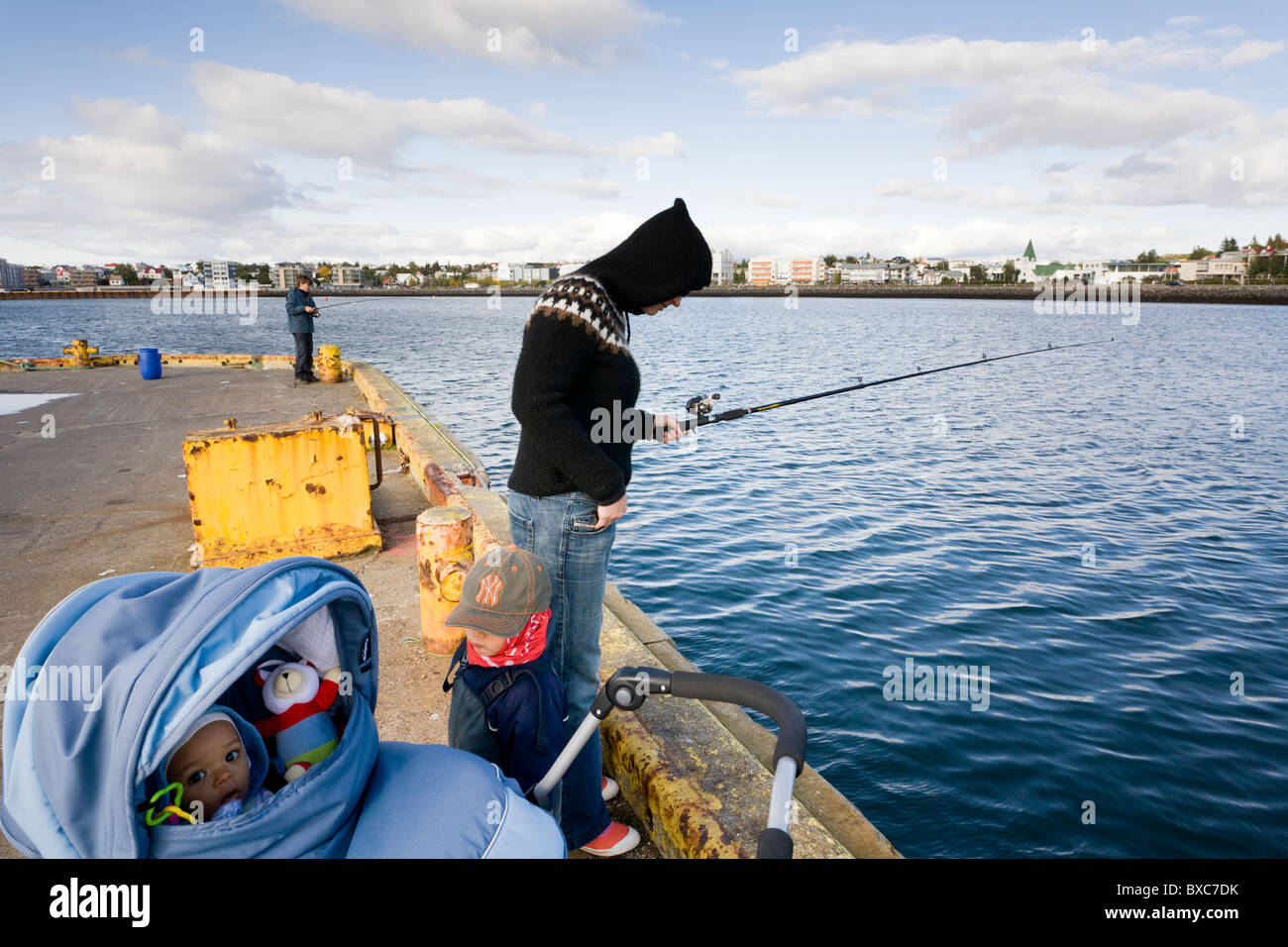 People fishing by the harbour, Hafnarfjordur, Greater Reykjavik Area ...