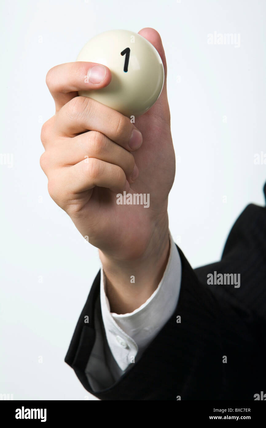 Isolated on white human hand showing lottery ball with number one Stock ...