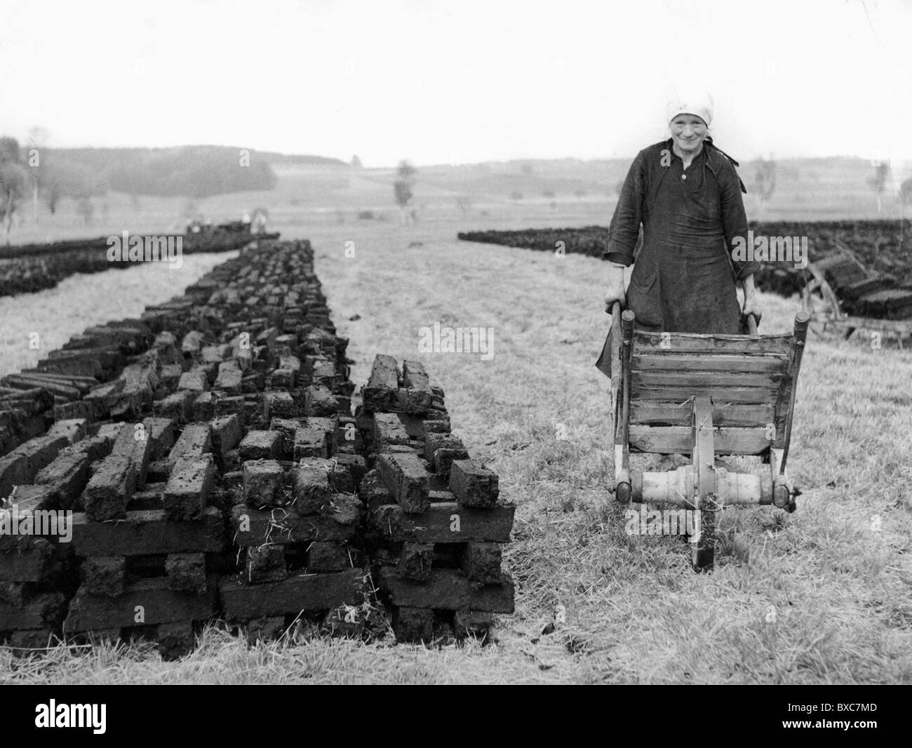Woman drying peat hi-res stock photography and images - Alamy