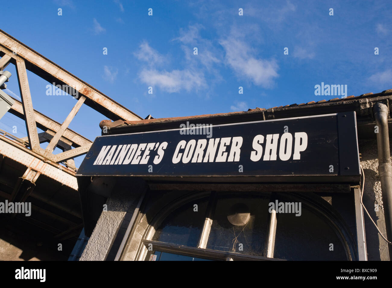 Corner shop under railway bridge at Maindee Newport South Wales UK ...