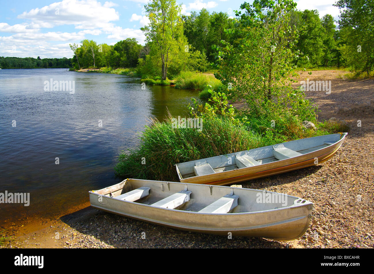 Small Boats on Shore Stock Photo - Alamy