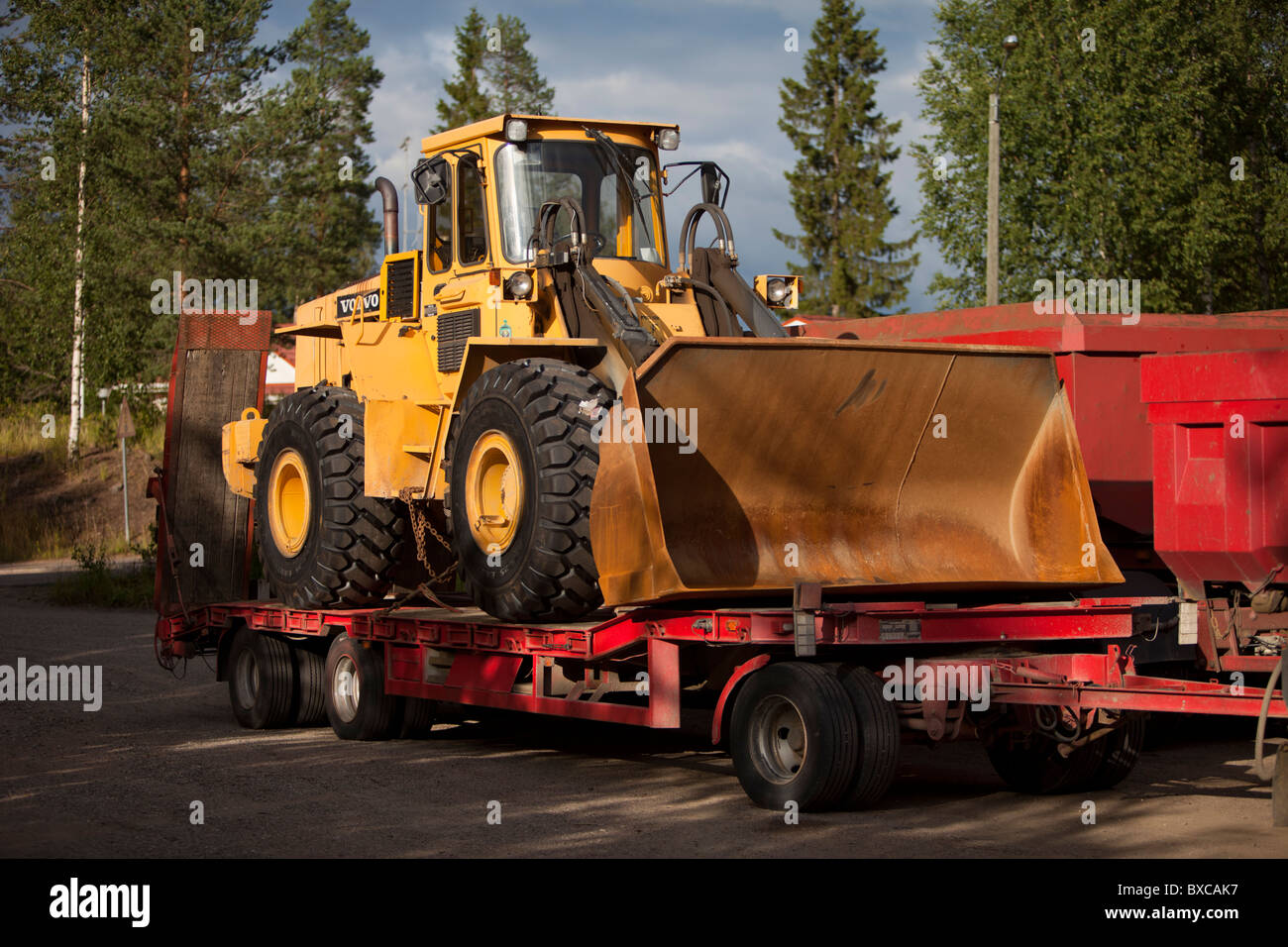Volvo front loader loaded to a truck trailer for transport , Finland ...