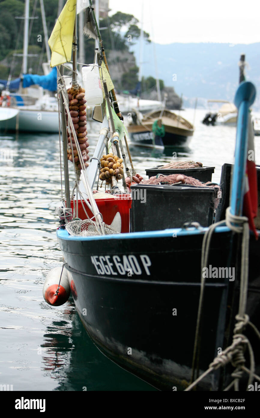 A small fishing boat in the harbour town of Portofino, Italy Stock ...