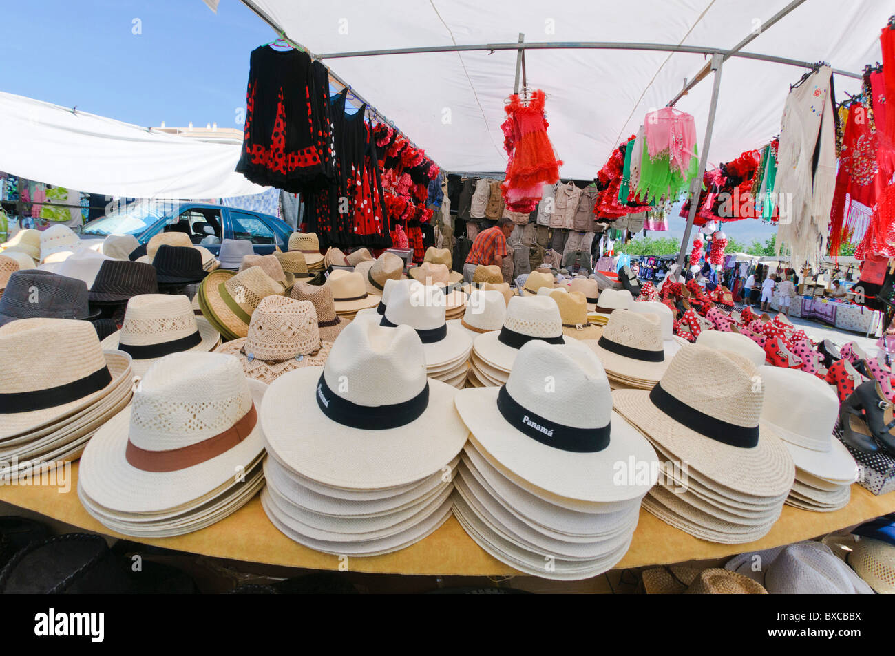 Stall selling hats in spanish market stall Stock Photo - Alamy