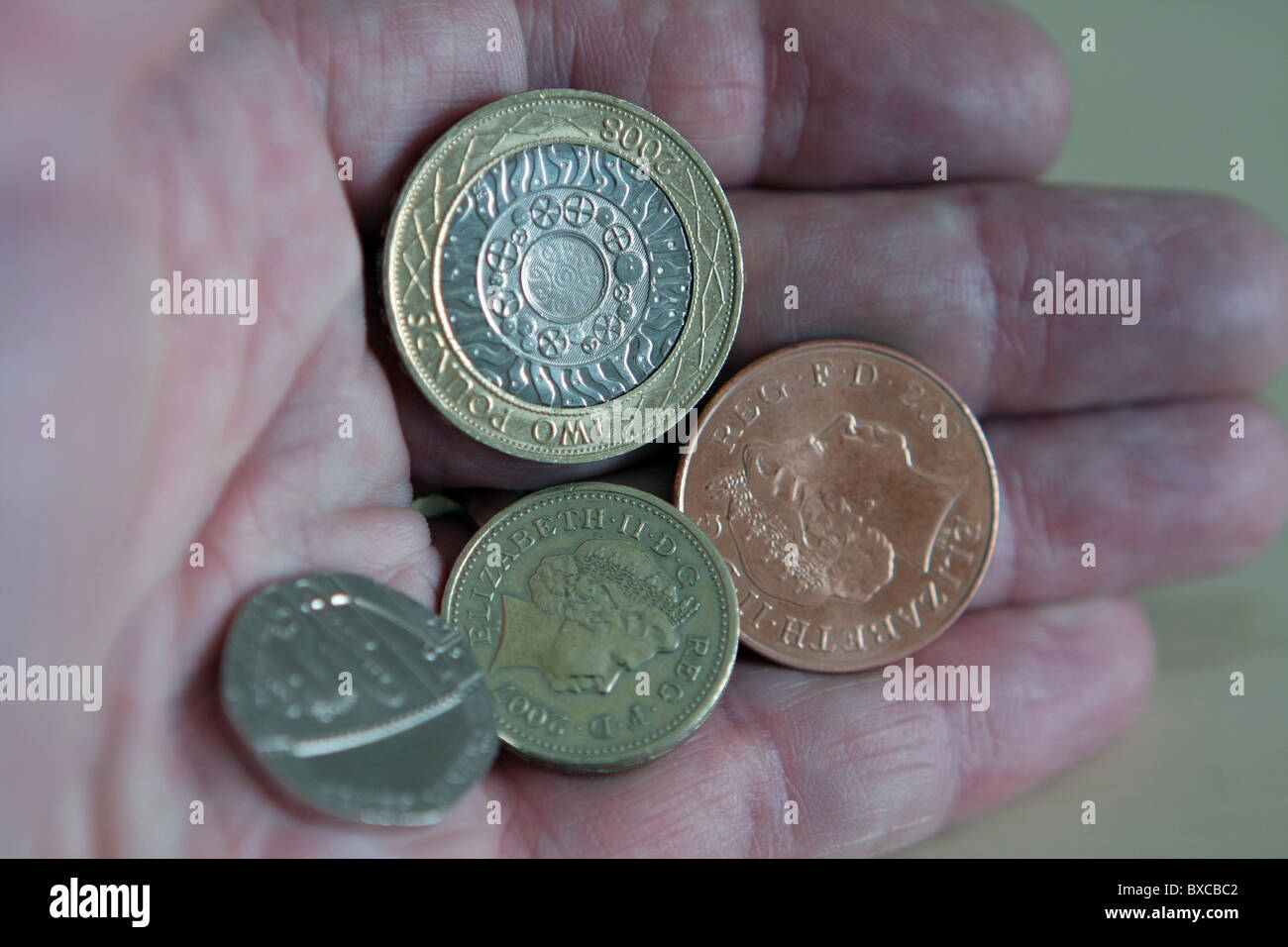20p coin hand hi-res stock photography and images - Alamy