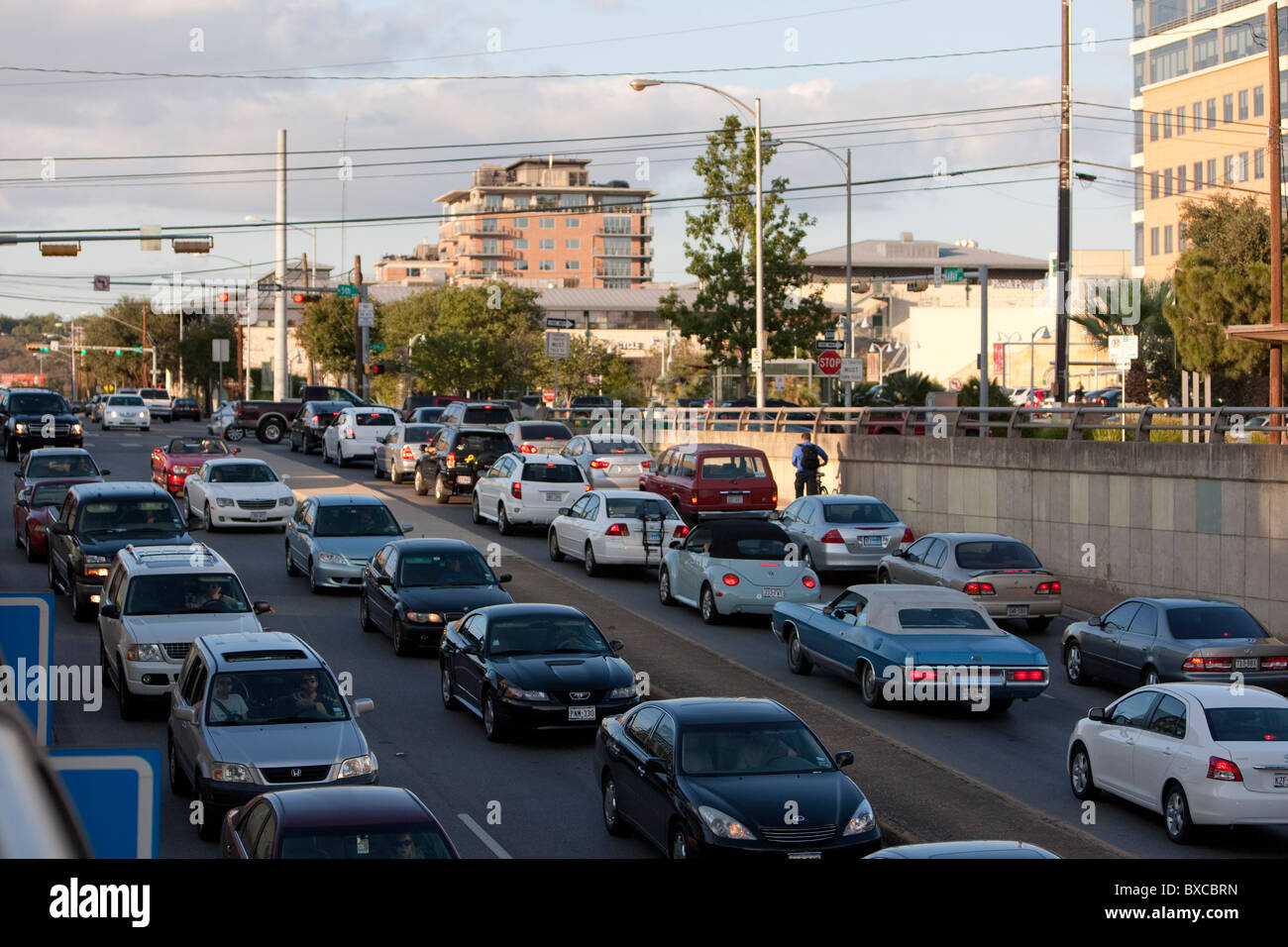 Rush hour traffic clogs the intersection of 5th and Lamar in the early ...