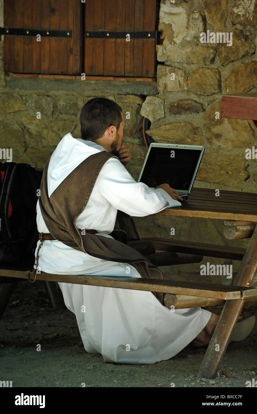 Monk of the Catholic Community of the Beautitudes Using a Laptop ...