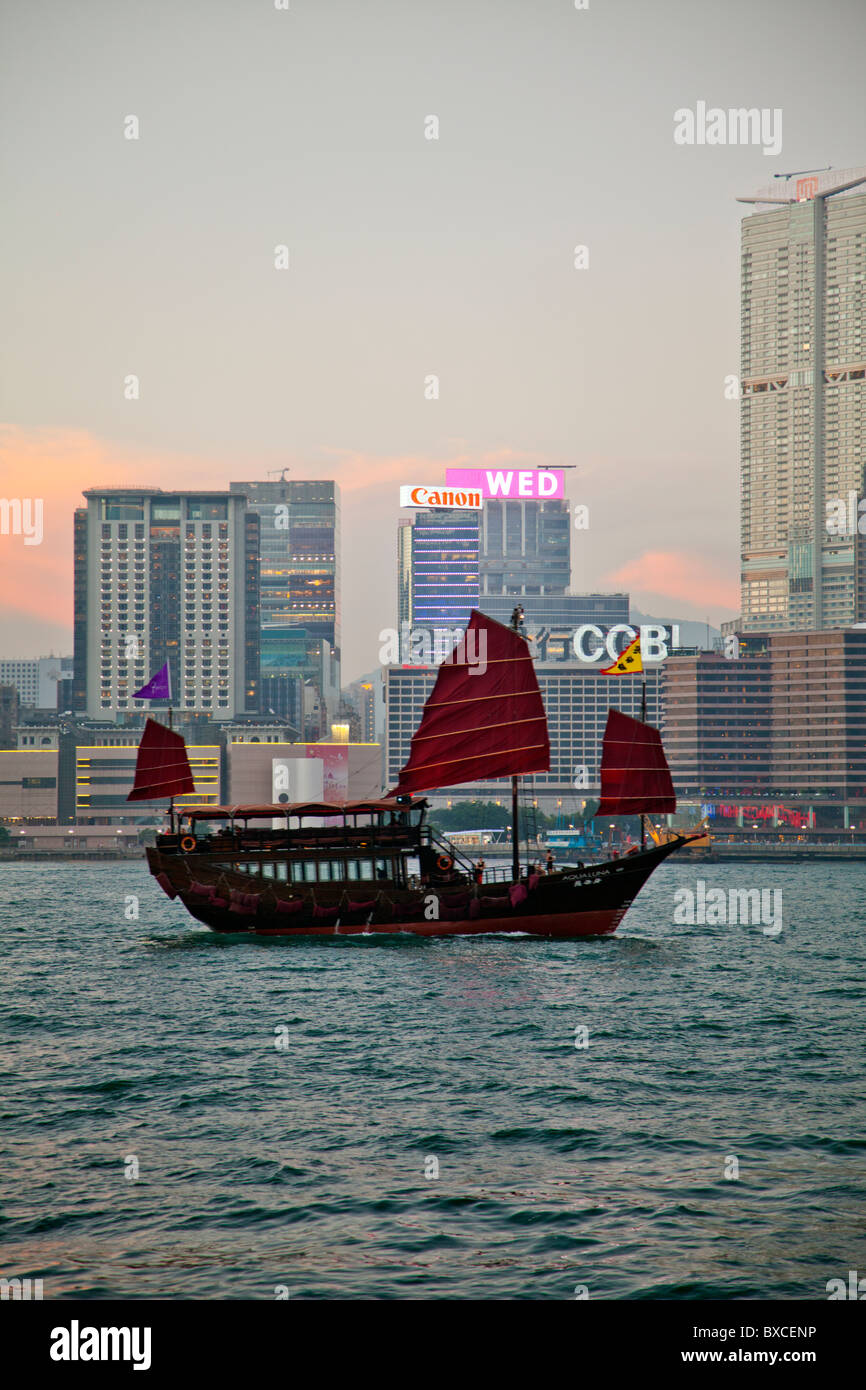 Hong Kong Junk Trips, on Victoria Harbour harbor with Kowloon skyline ...