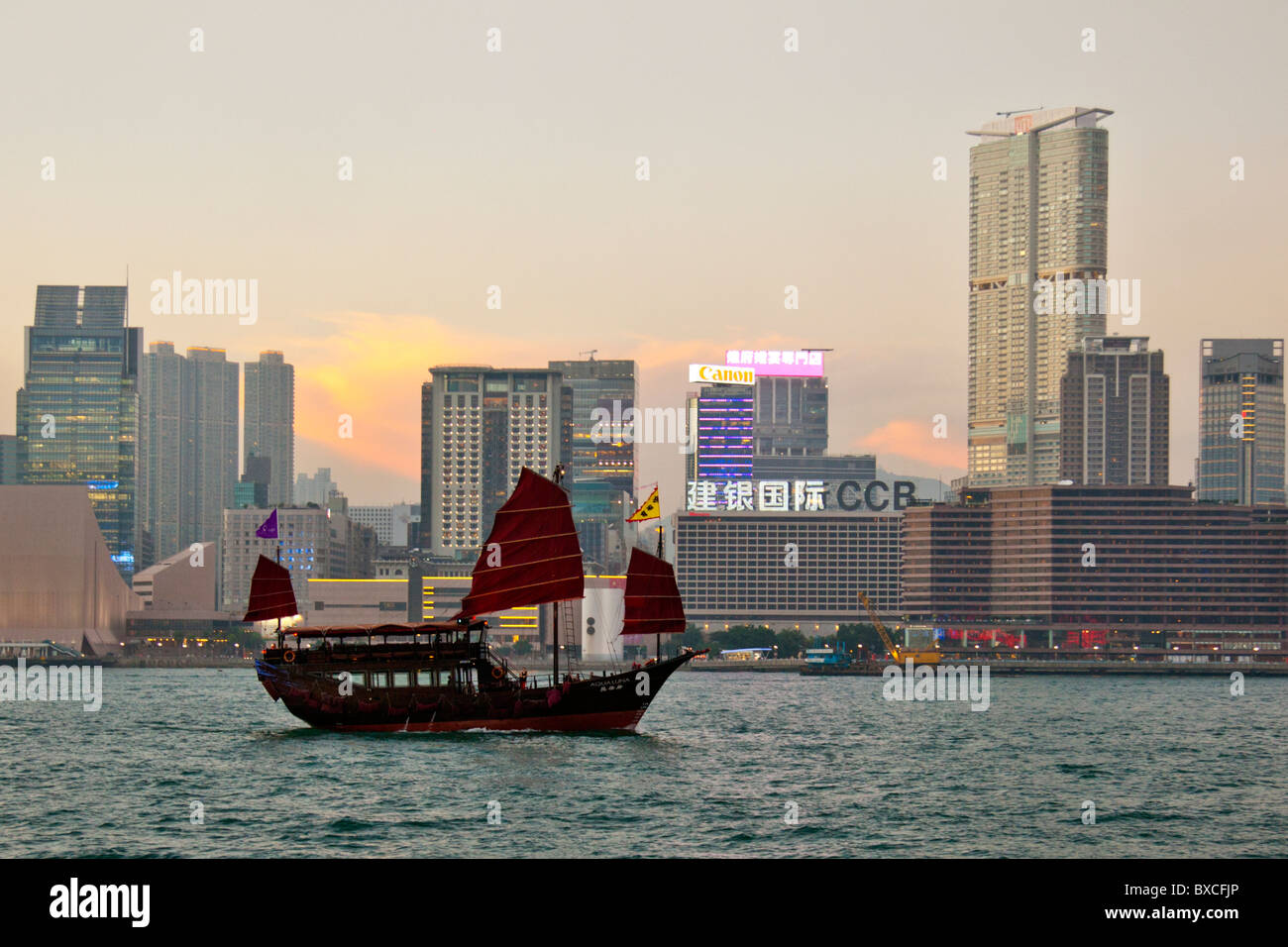 Hong Kong Junk Trips, on Victoria Harbour harbor with Kowloon skyline ...