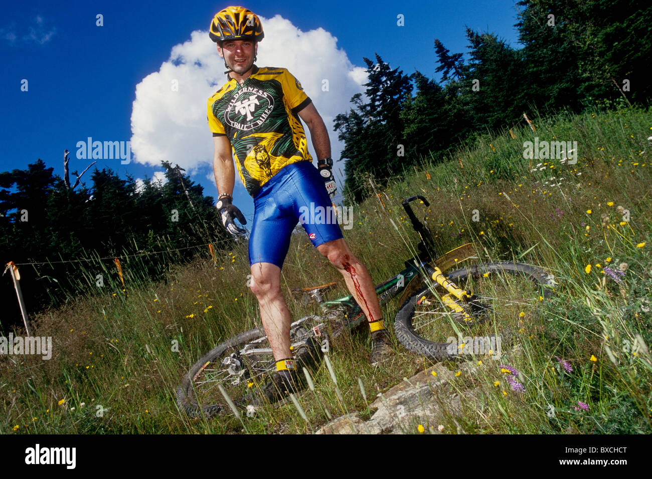 Injured mountain bicyclist Stock Photo - Alamy