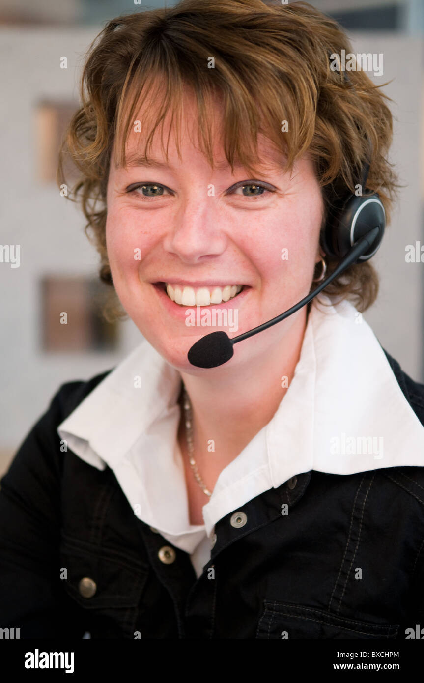 Female helpdesk worker Stock Photo - Alamy