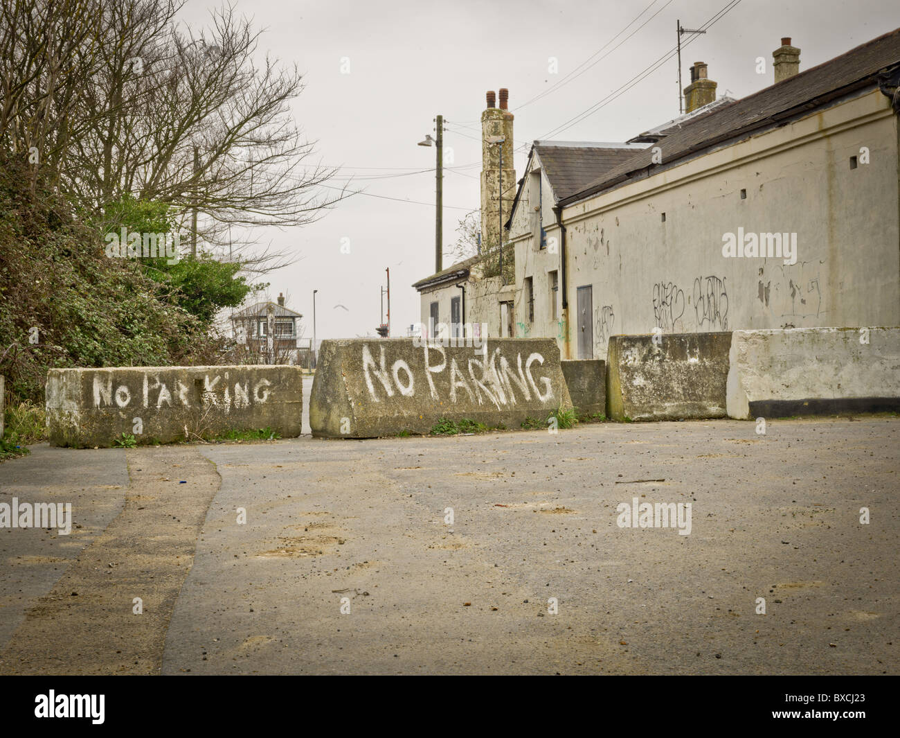 Blocked off abandoned road Stock Photo - Alamy