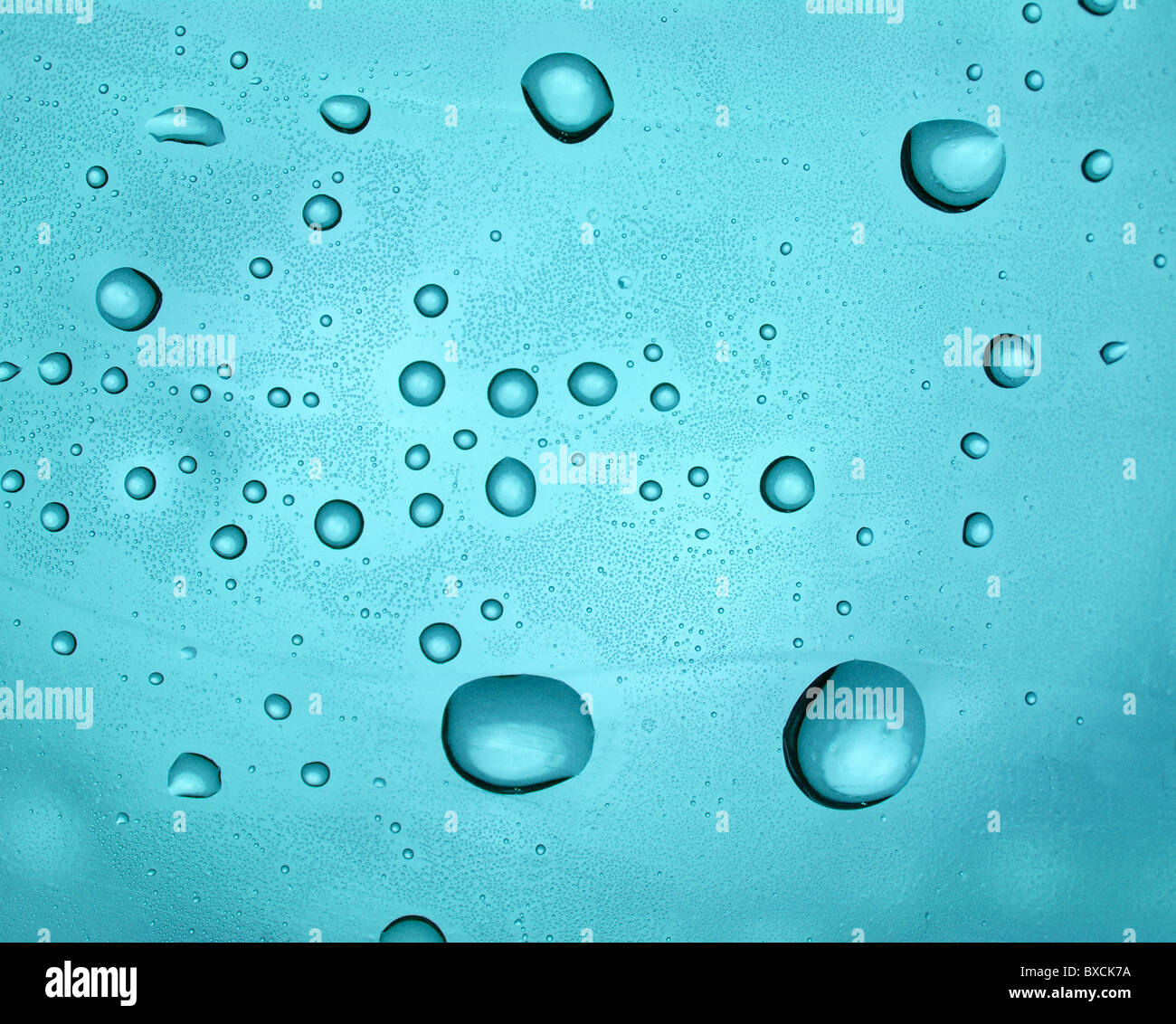 Water droplets on transparent blue surface Stock Photo - Alamy
