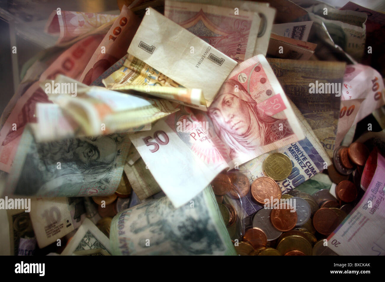 Banknotes and coins Stock Photo - Alamy