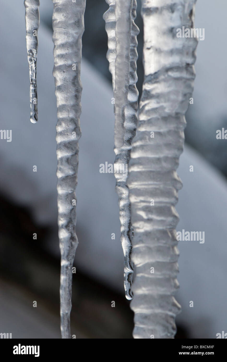 Icicles hanging off a roof. Ice. Winter Stock Photo - Alamy
