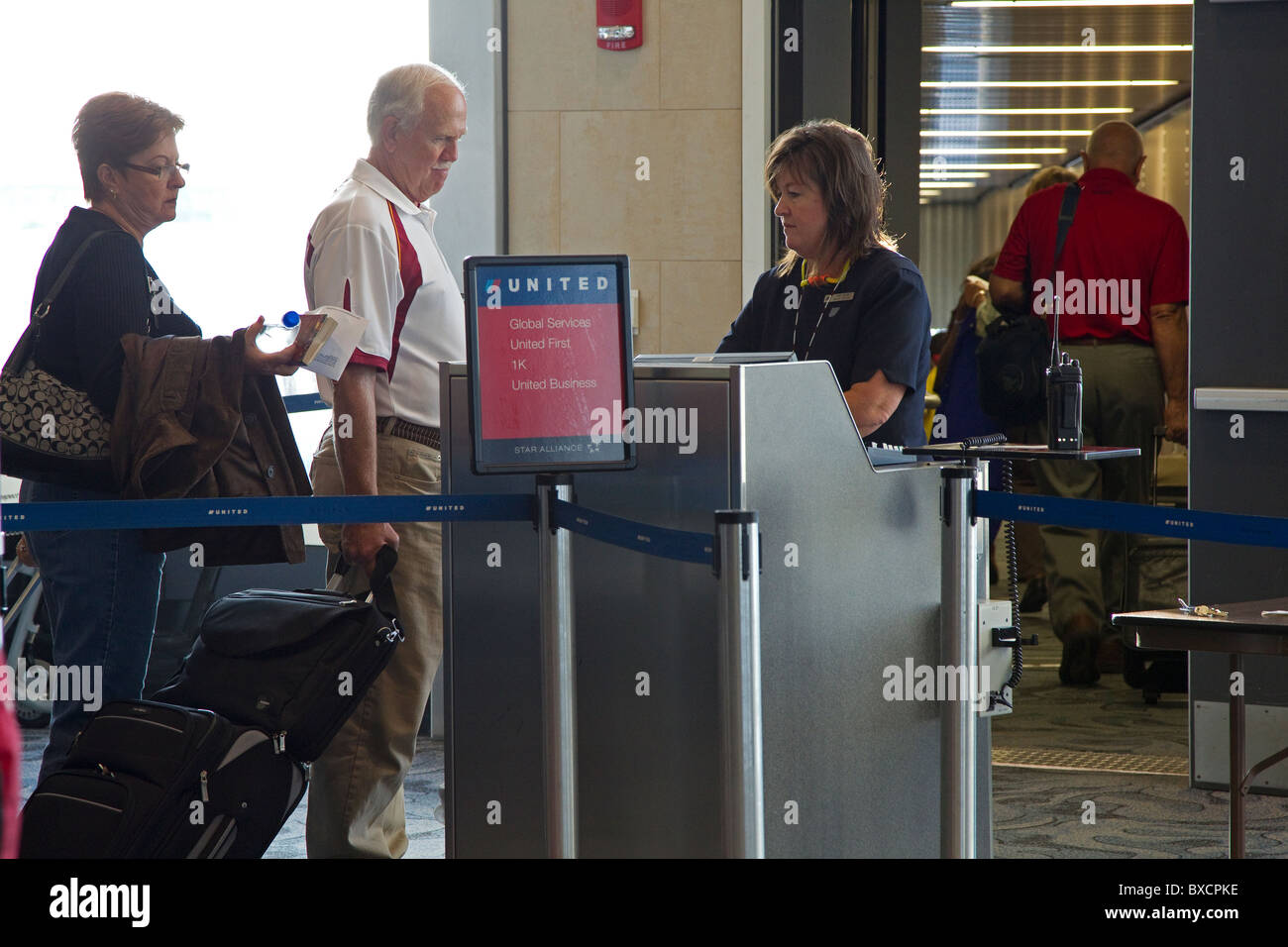 Travelers queue up to board a plane, Tampa International Airport, USA ...
