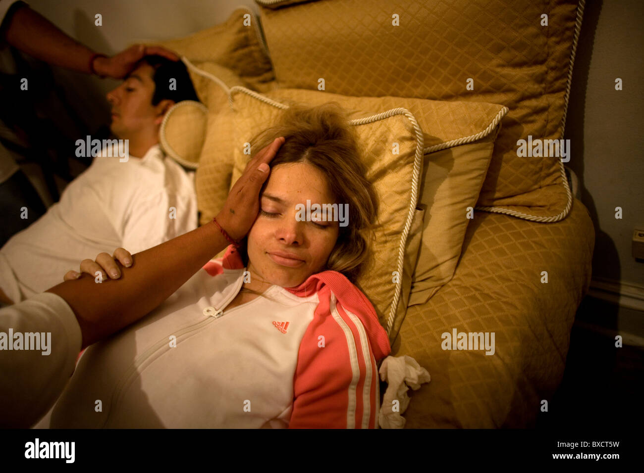 A young couple receives Reiki in Mexico City Stock Photo - Alamy
