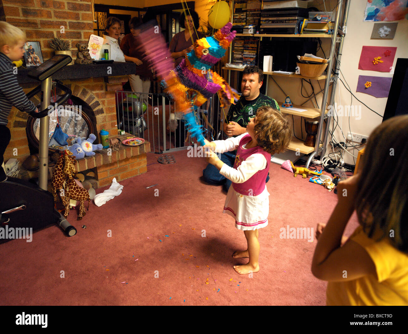 Four Year Old Hitting a Pinata at Birthday Party in England Stock Photo ...