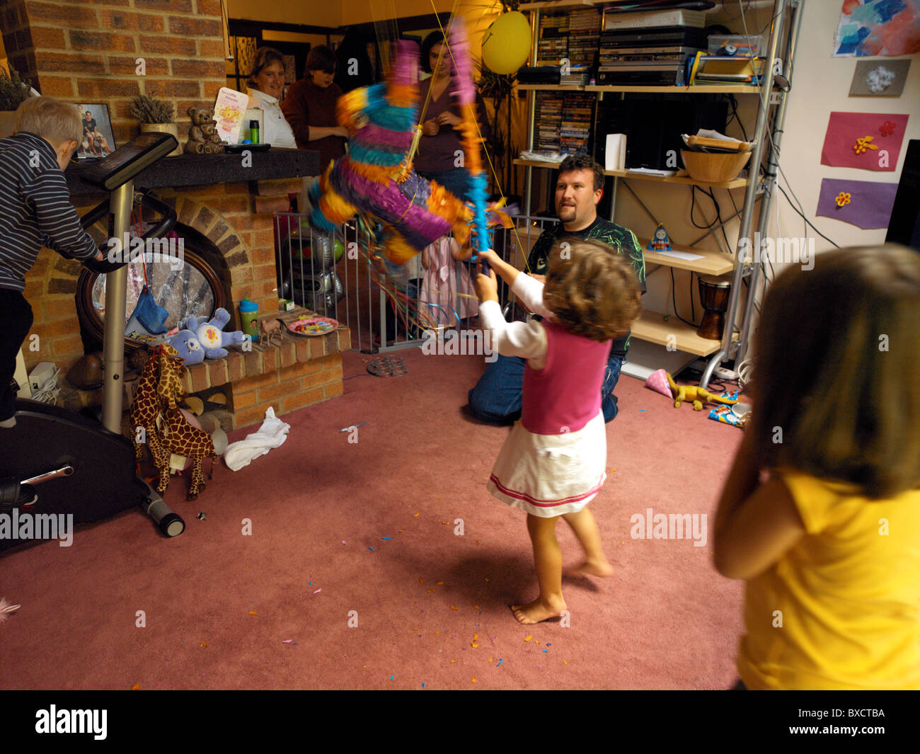 Four Year Old Hitting a Pinata at Birthday Party in England Stock Photo ...