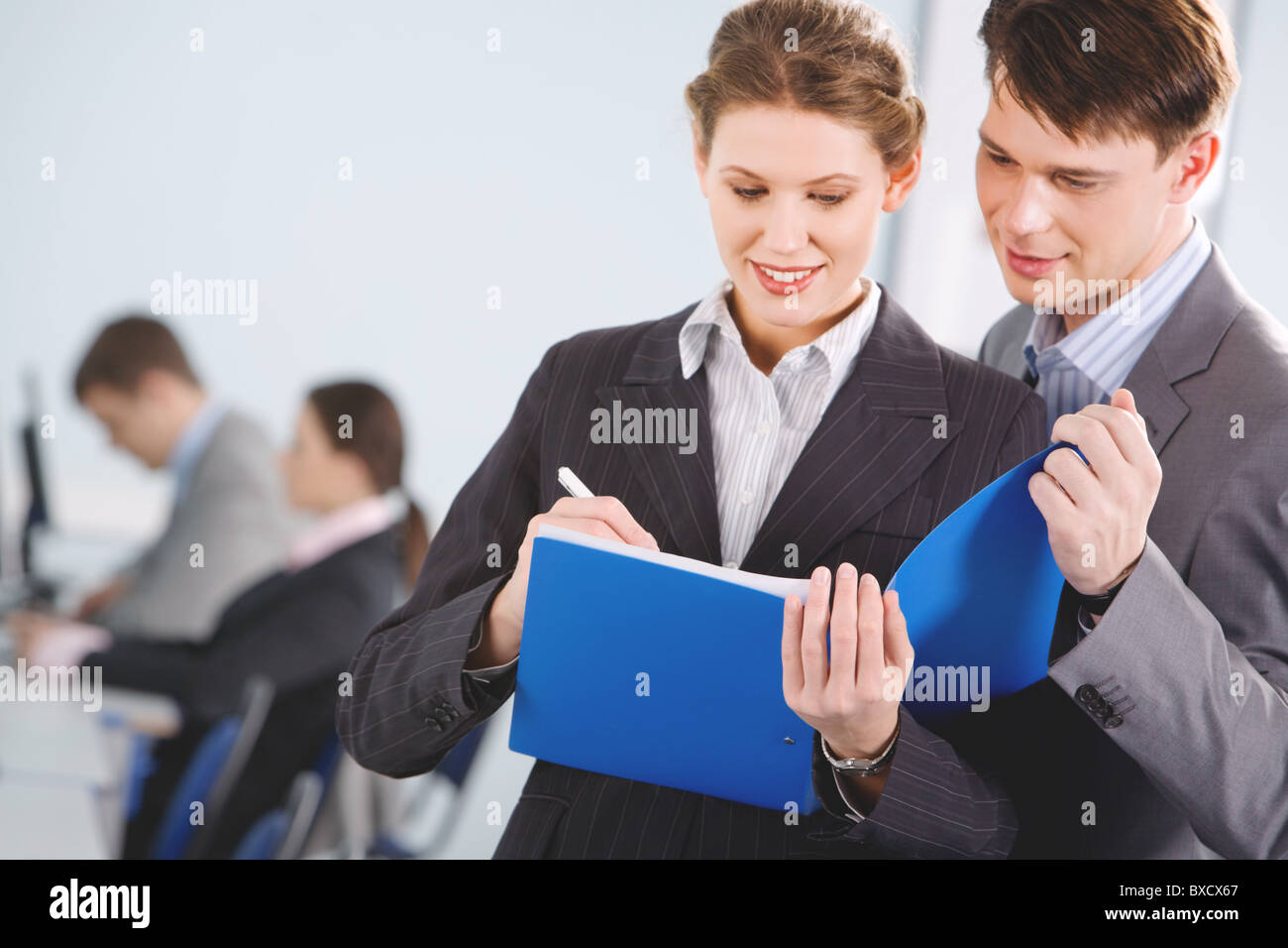 Image of business people interacting in a working environment Stock ...