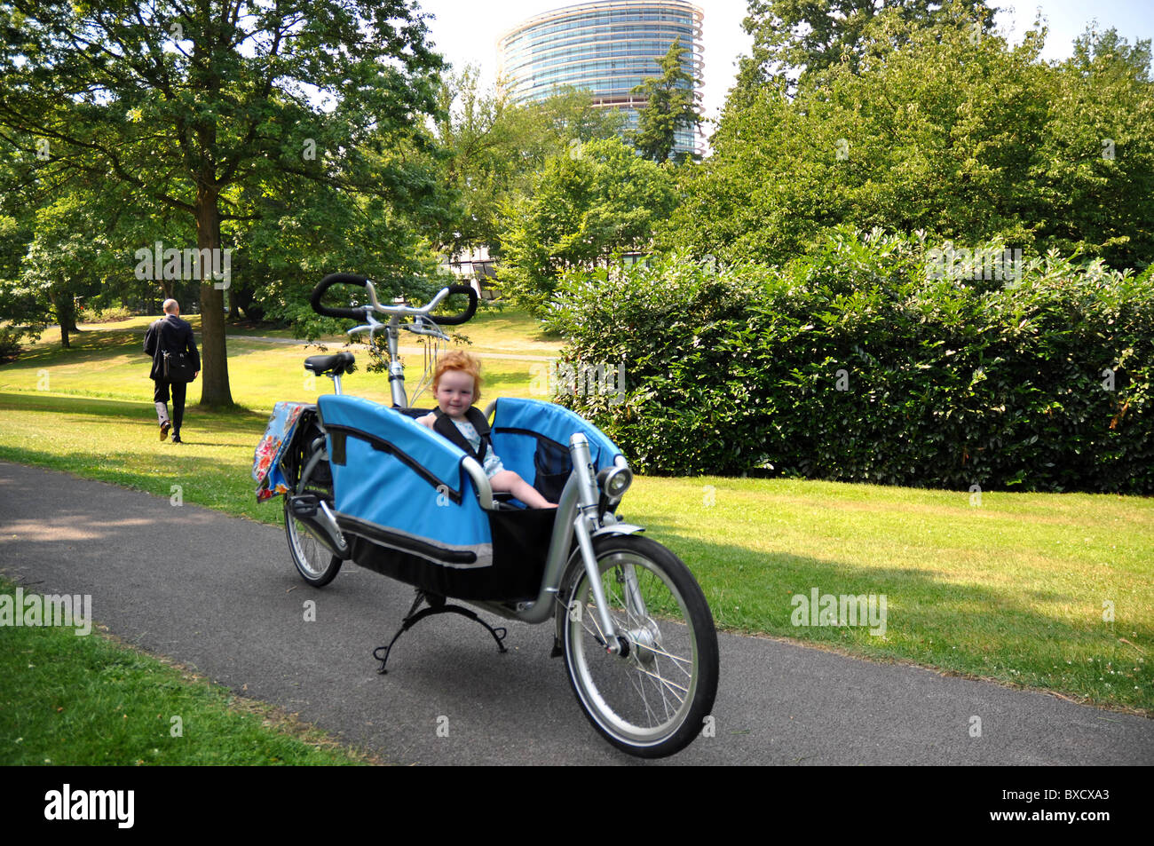 Business man leaving child baby creche bike carrier hi-res stock ...