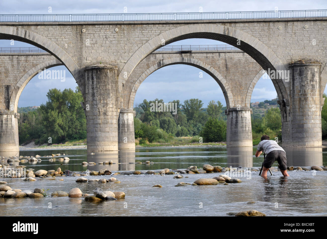 Professional photographer working under difficult circumstances Stock ...