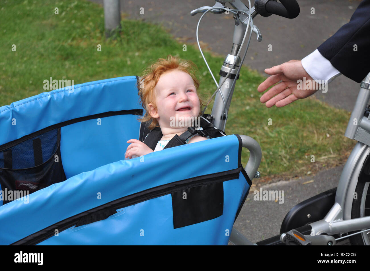 Business man leaving child baby creche bike carrier hi-res stock ...