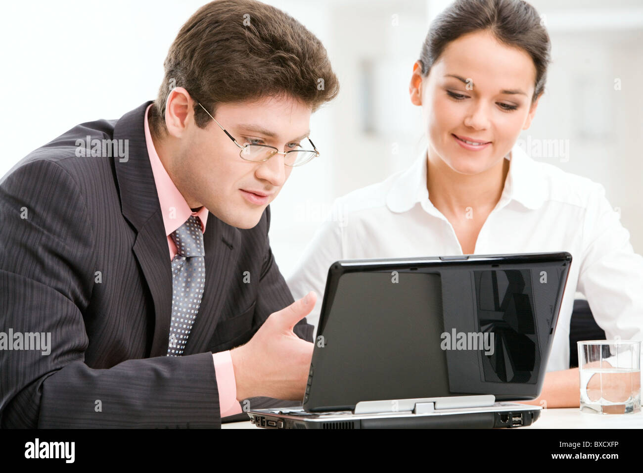 Portrait of two business people working together Stock Photo - Alamy