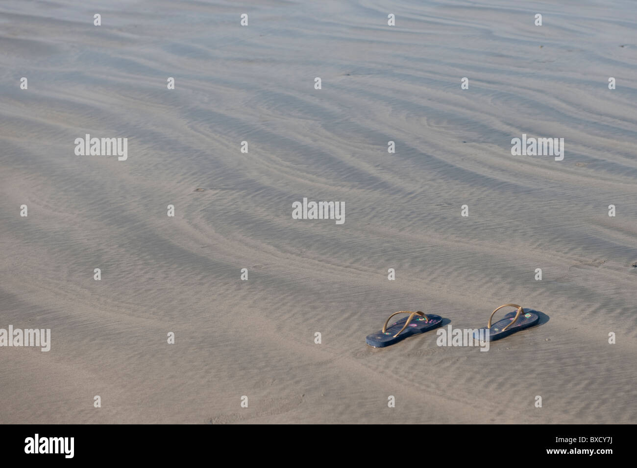 Shoes on sand Stock Photo - Alamy
