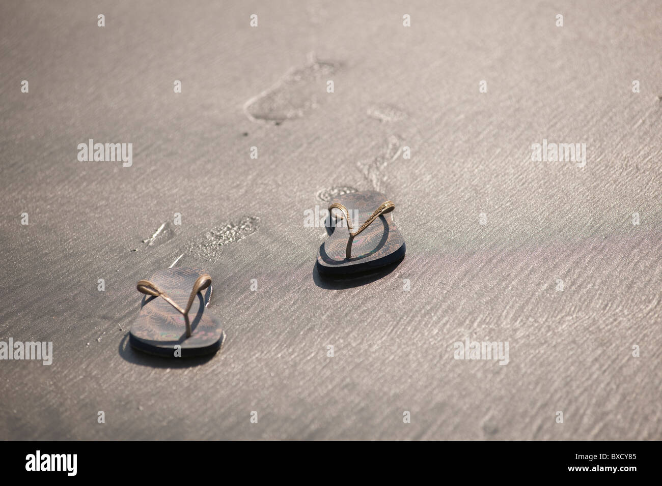 Shoes on sand Stock Photo - Alamy